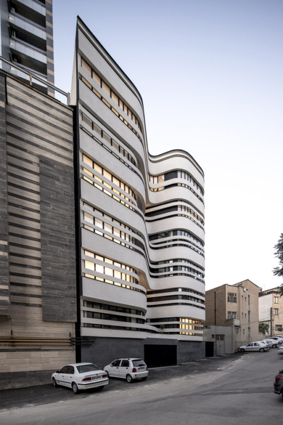 Three towers in Iran are unified as one through a curvilinear facade ...